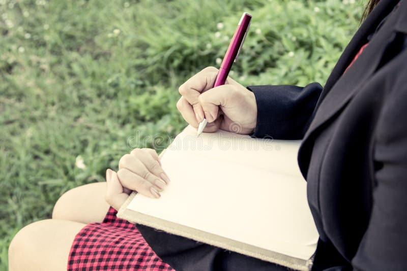 Woman Hand Writing Her Notebook in the Garden Stock Image - Image of ...