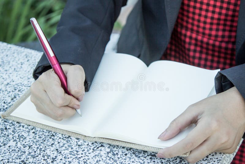 Woman Hand Writing Her Notebook Stock Photo - Image of happy, casual ...