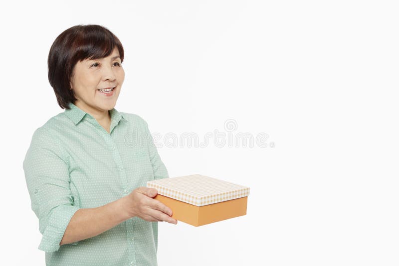 Woman Handing Out a Gift Box Stock Photo - Image of isolated, casual ...