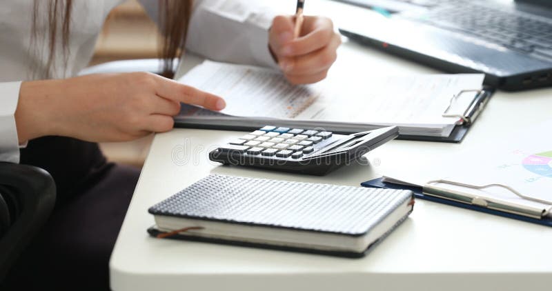 Woman Hands Counting on Calculator and Filling Documents in Modern ...