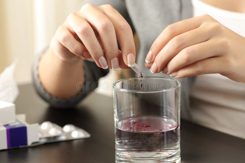 Woman Hands Dissolving a Capsule Content in Water Stock Photo - Image ...