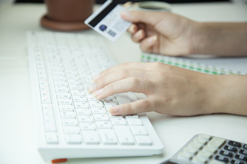 Woman Hands Holding a Credit Card and Using Computer Keyboard Stock ...