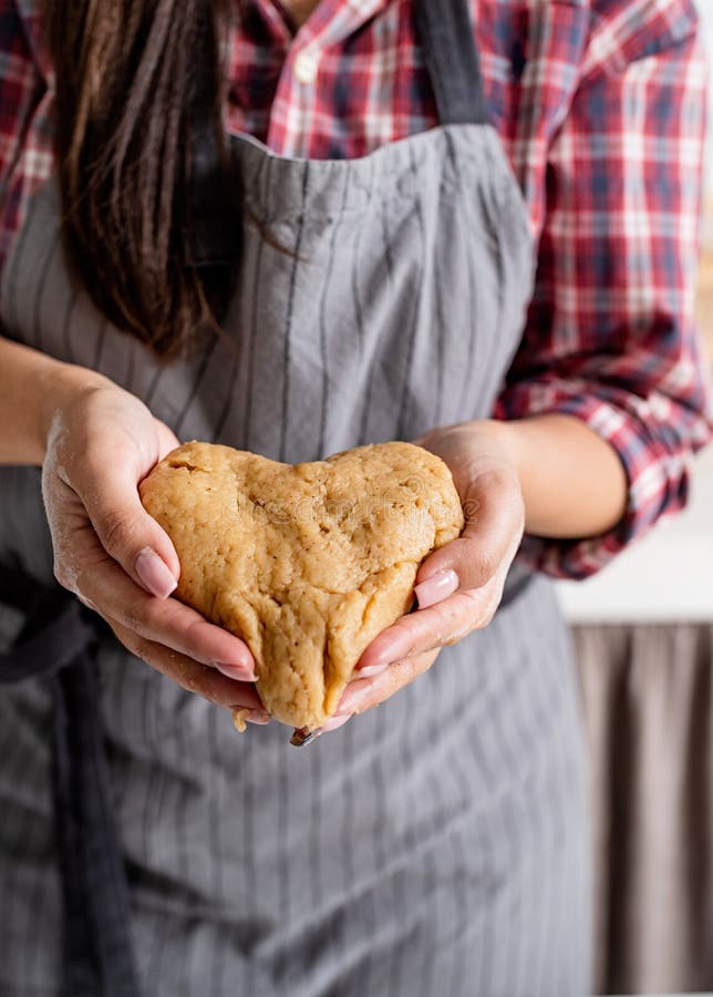 Woman Hands Holding Heart Shaped Dough Stock Photo - Image of beautiful ...