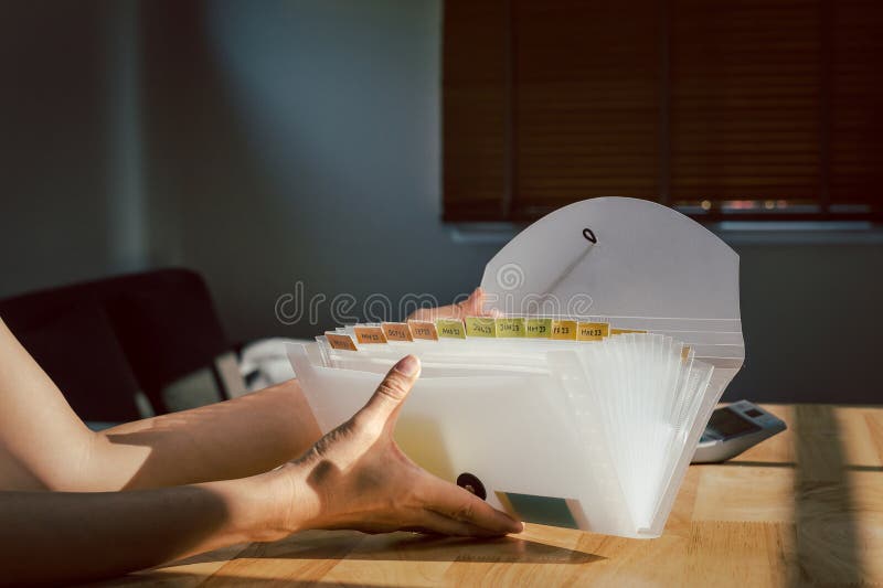 Woman Hands Organizing Folder on a Desk at Home. Stock Image - Image of ...