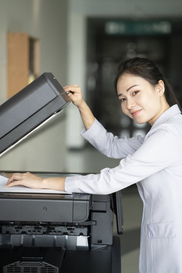 Woman Hands Putting a Sheet of Paper into a Copying Device or Printer ...