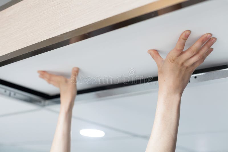 Woman Hands Removing White Panel on Ceiling. Stock Image - Image of ...