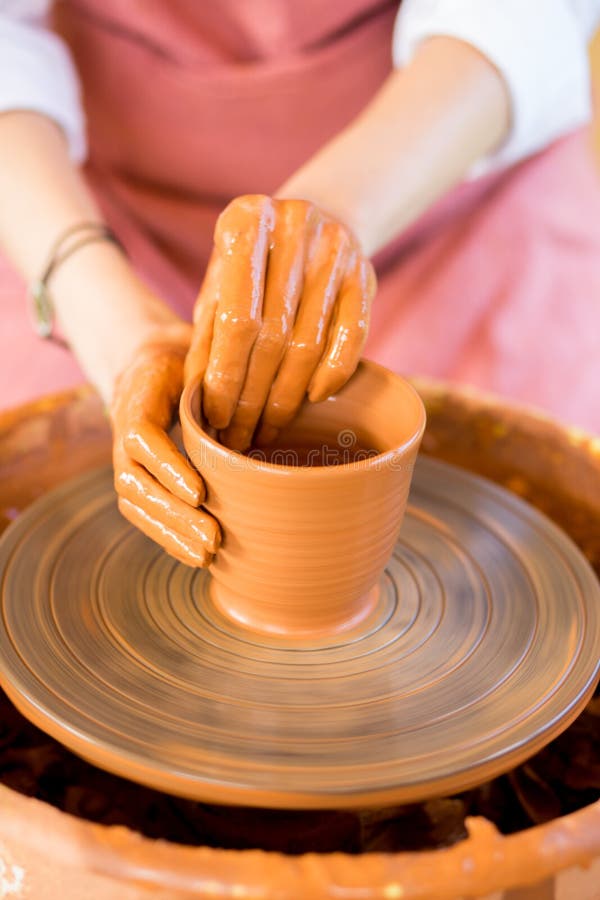Hands Sculpts Cup from Clay Pot. Workshop of Modeling on Potter Wheel ...