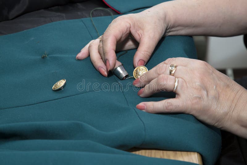 Woman Hands Sewing a Button Stock Image - Image of woman, lifestyle ...