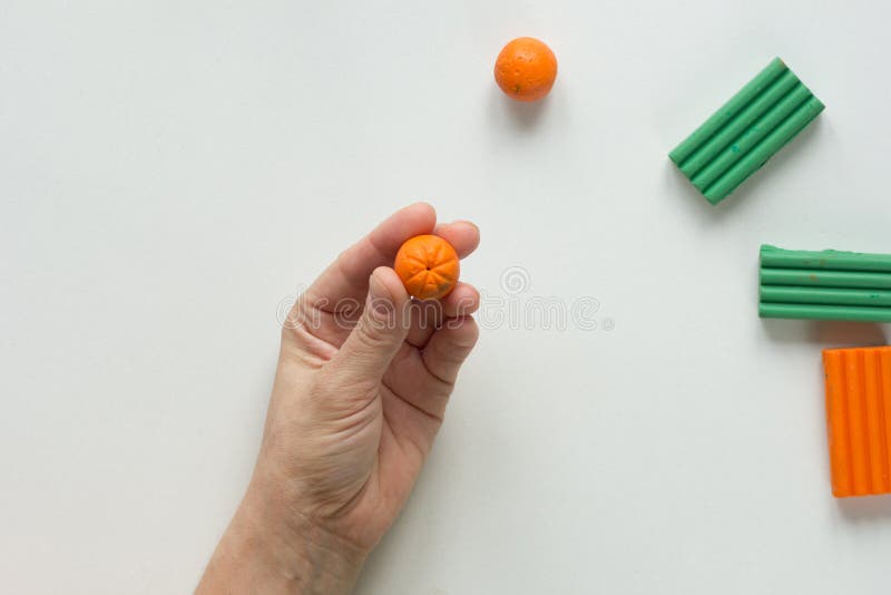 Woman Hands Showing Dot on Orange Ball To Create Orange Fruit from ...