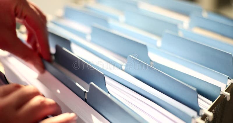 Woman Hands are Sorting through Documents in Folder in Archive Closeup ...