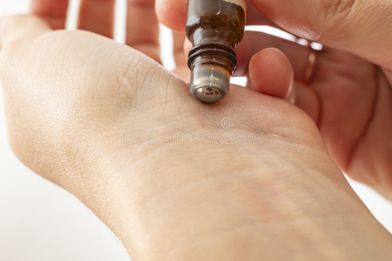 Woman Hands Testing a Roll on with Essential Oil , Applying Liquid on ...