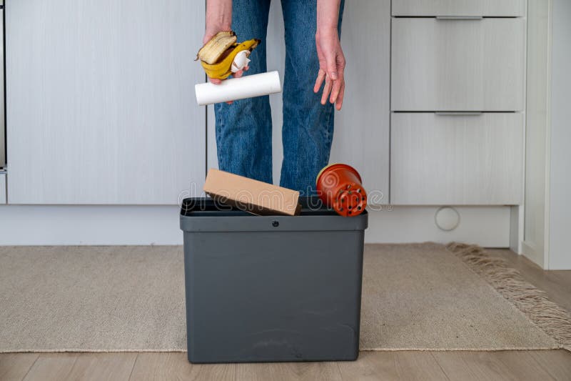 Woman Hands Throwing Out Cardboard, Glass, Plastic and Bio Garbage into ...