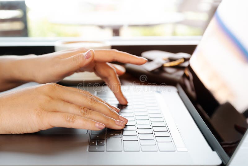 Woman Hands Typing on Laptop Keyboard. Woman Working at Office with ...