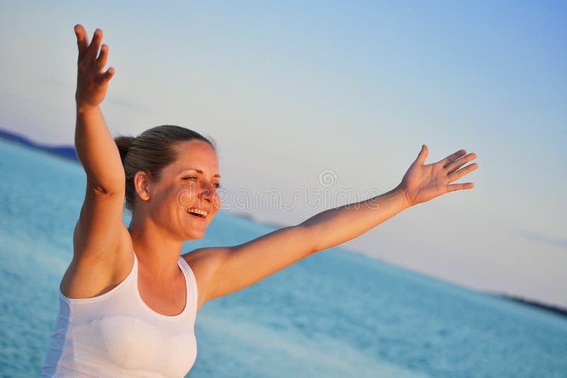 Woman with Hands Up Expressing Joy on the Beach Stock Image - Image of ...
