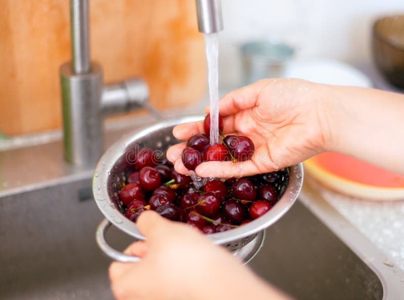 Woman Hands Washing Cherries in the Kitchen Stock Photo - Image of ...