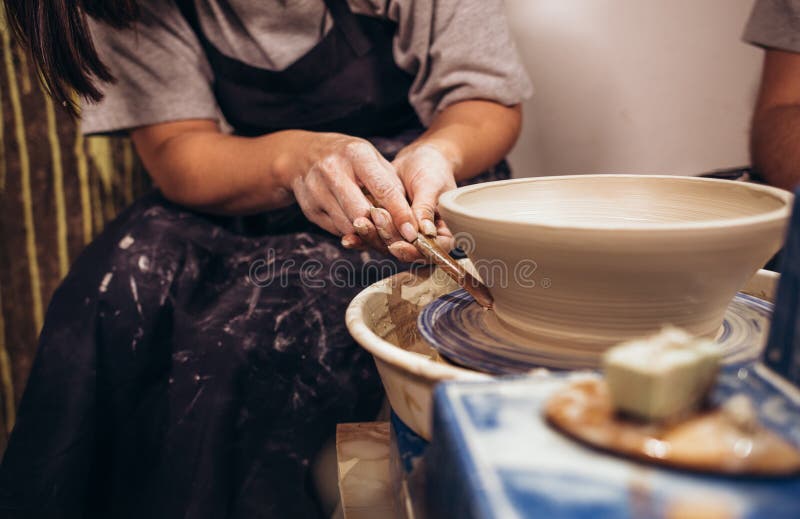 Woman Hands Working on Pottery Wheel and Making a Pot. Stock Photo ...