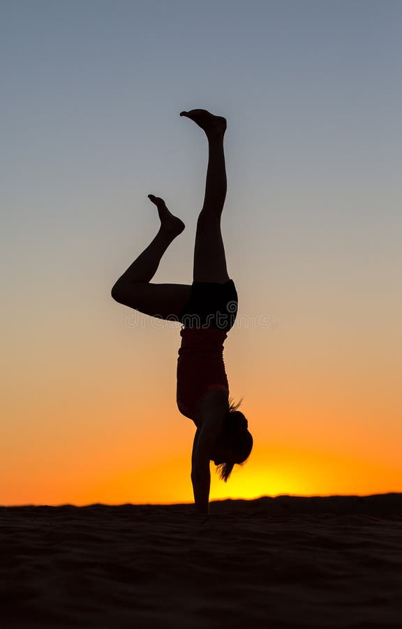 Woman Doing Handstand Beach Stock Photos - Download 150 Royalty Free Photos