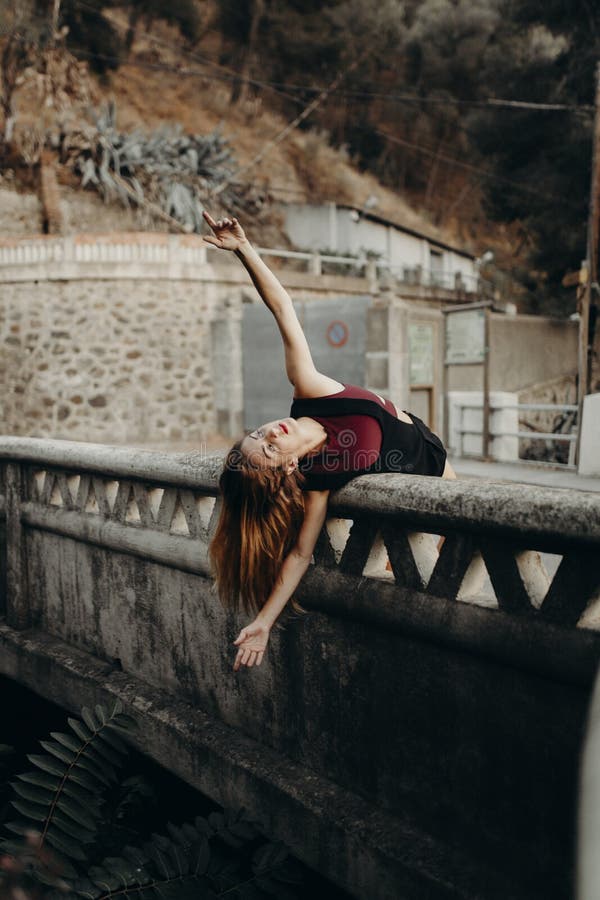 Woman Hanging from a Bridge. Stock Image - Image of sunset, lifestyle ...