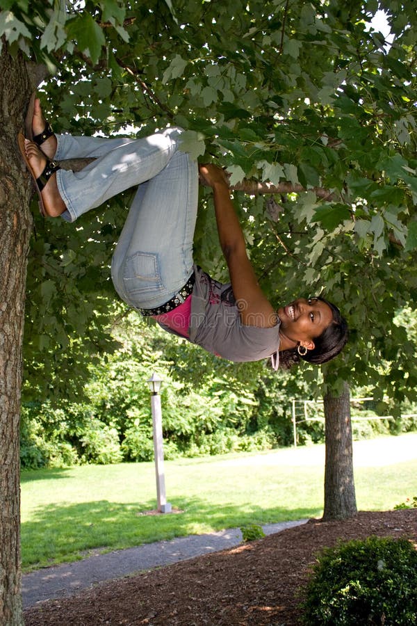 Woman Hanging from a Tree stock image. Image of branch - 15977519