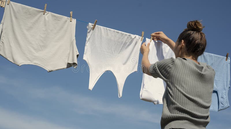 Woman Hangs Laundry on Clothesline Stock Image - Image of nature, wash ...