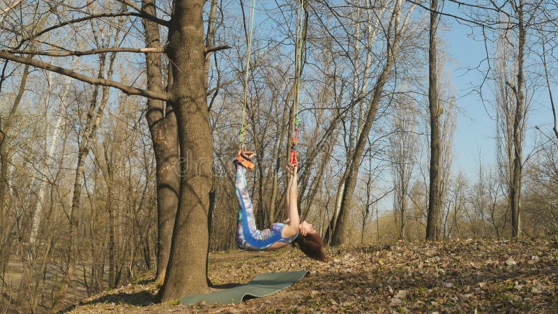Flexible Woman Make a Split on Hanging Ropes Stock Footage - Video of ...