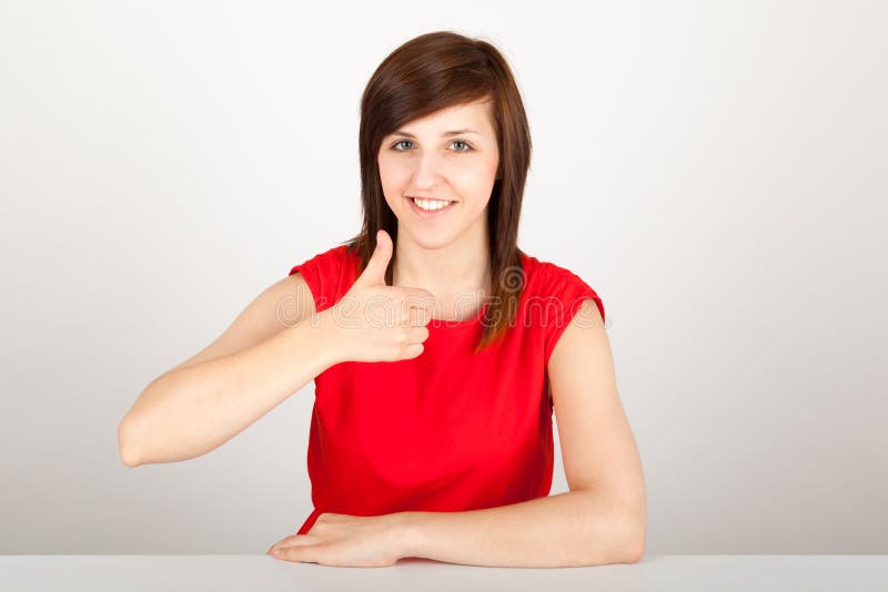 The Woman is Happily Sitting at the Table. Stock Photo - Image of ...
