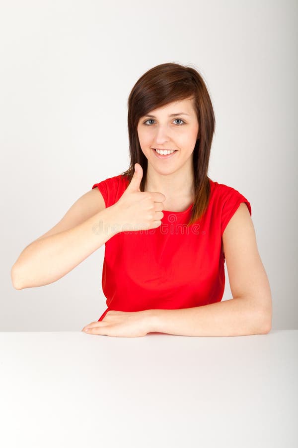 The Woman is Happily Sitting at the Table. Stock Photo - Image of hand ...