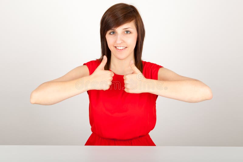 The Woman is Happily Sitting at the Table. Stock Photo - Image of thumb ...