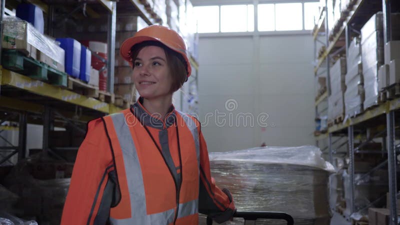 Woman at Hard Work, Laborer in Uniform Pulling Trolley with Boxes ...