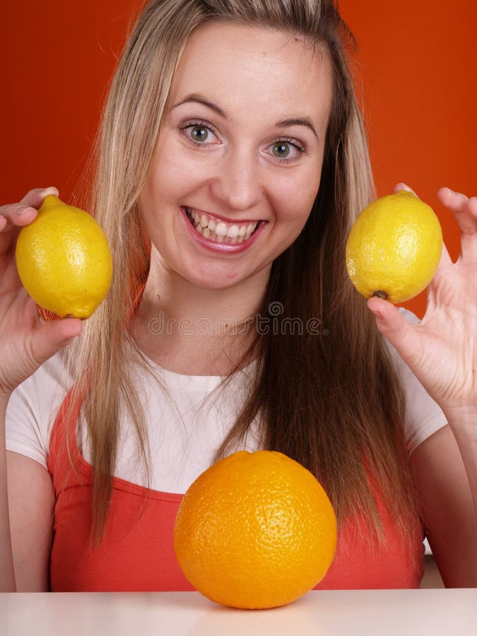 Woman sucking on a lemon stock photo. Image of squeeze - 13558790