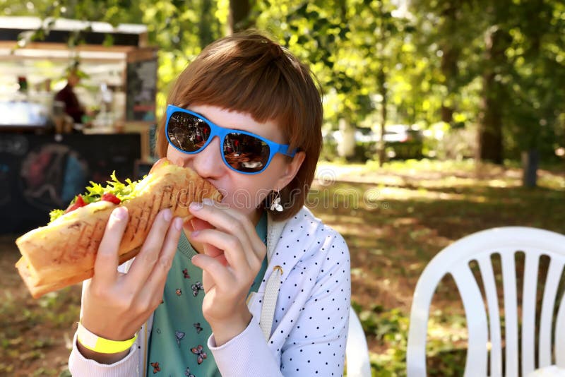 Woman has sandwich stock photo. Image of hungry, holding - 157377678
