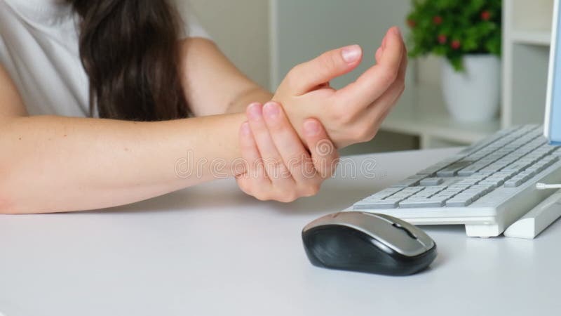 A Woman Has a Sore Wrist after Working at the Computer, Tunnel Syndrome ...