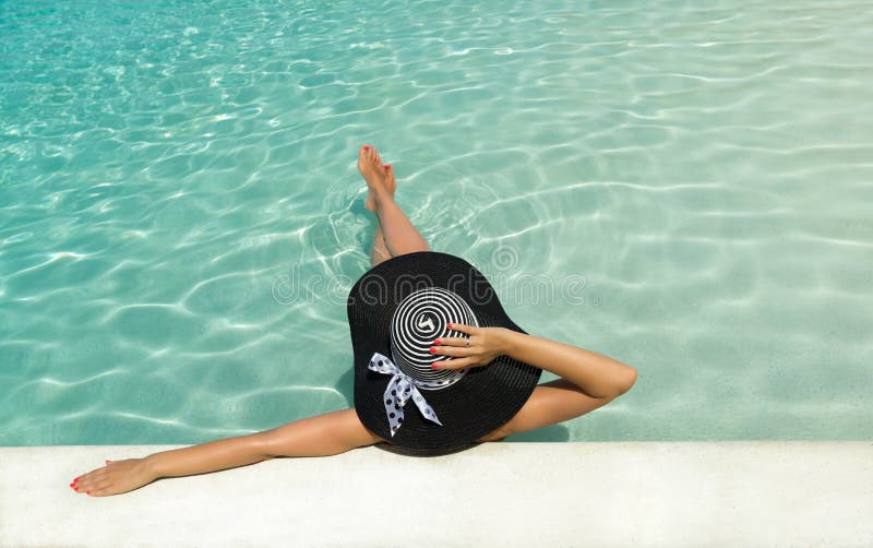 Woman in Hat Relaxing at the Pool Stock Photo - Image of blue, heat ...