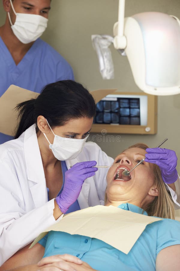Woman Having Check Up at Dentists Surgery Stock Image - Image of male ...