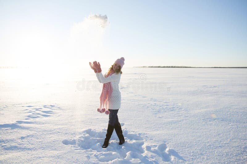 Woman Having Fun and Throwing Snow in Winter Field Stock Photo - Image ...