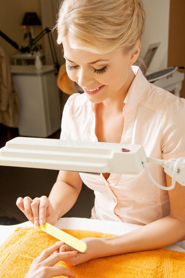 Woman Having a Manicure at the Salon Stock Image - Image of happy, lady ...