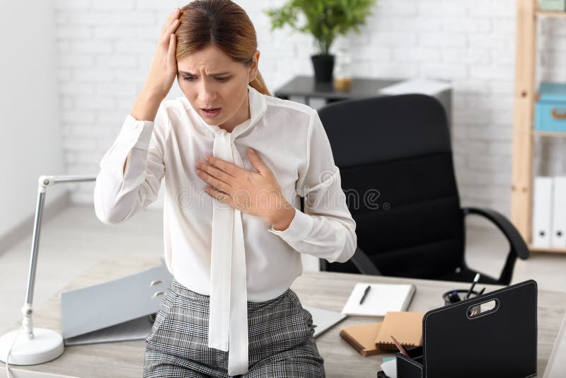 Woman Having Panic Attack at Workplace Stock Photo - Image of panic ...
