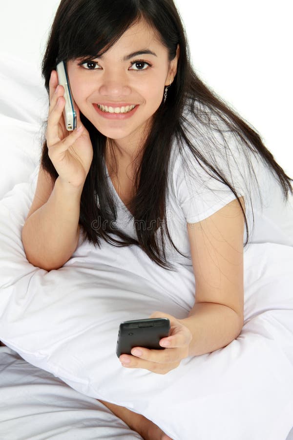 Woman Having a Phone Call while Texting Message Stock Photo - Image of ...