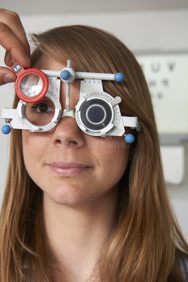 Eye Test. Optometrist Testing Woman Eyesight on Modern Equipment Stock ...