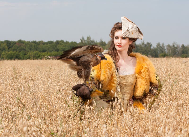 Woman with hawk on hand stock photo. Image of brown, natural - 34943966