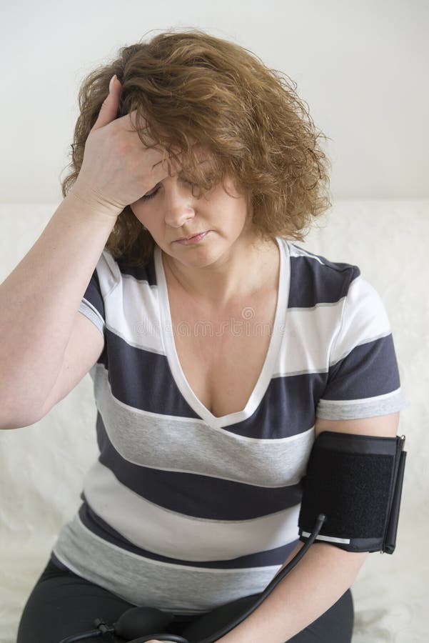 Woman with Headache Measures a Blood Pressure Stock Image - Image of ...