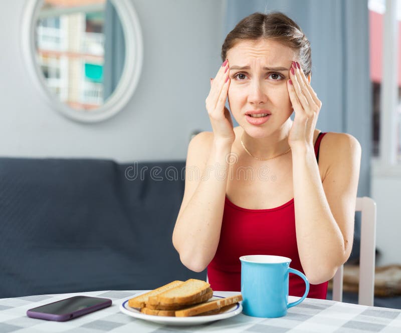 Woman with Headache Sitting at Table at Home Stock Image - Image of ...