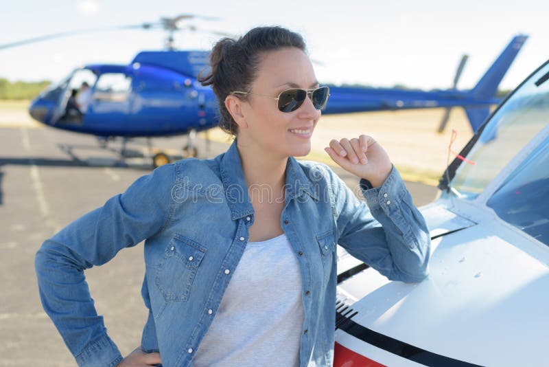 Woman and helicopter stock photo. Image of young, helicopter - 246349488