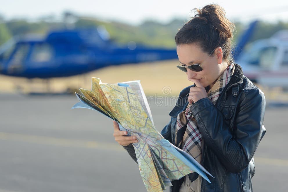 Woman Helicopter in Background Pilot Reading Map Stock Photo - Image of ...
