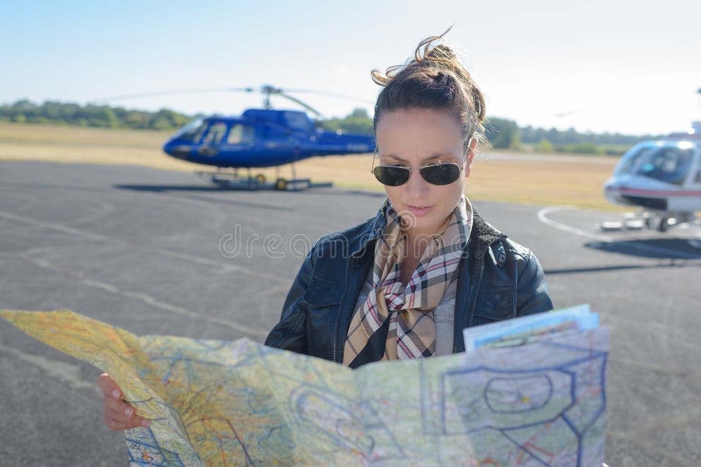 Woman Helicopter Pilot Reading Map Stock Image - Image of industry ...