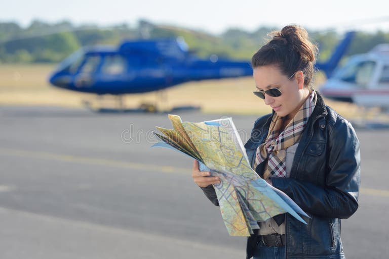 Woman Helicopter Pilot Reading Map Stock Photo - Image of concentration ...