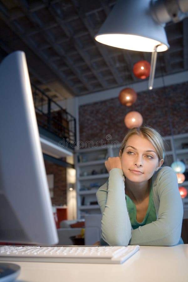 A Young Woman at Her Computer Stock Photo - Image of happiness, face ...