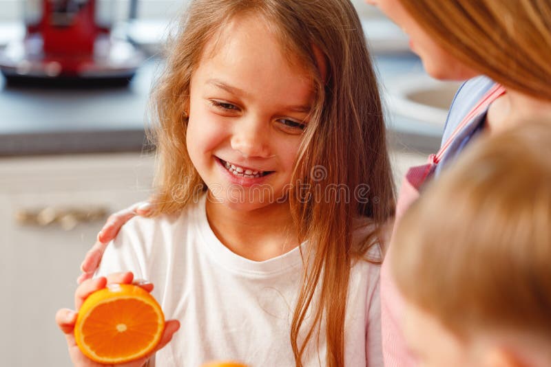 Woman and Her Kids Cooking in Kitchen Stock Photo - Image of cooking ...