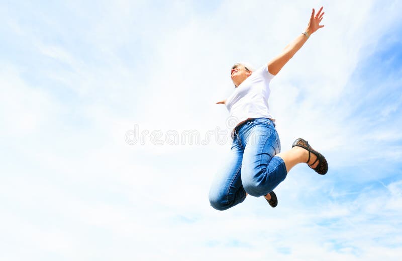 Woman in Her 50s Jumping High Stock Image - Image of active, activity ...