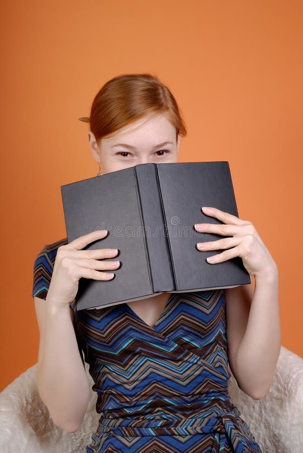 Woman Hides The Face Behind The Book Picture. Image: 8231248